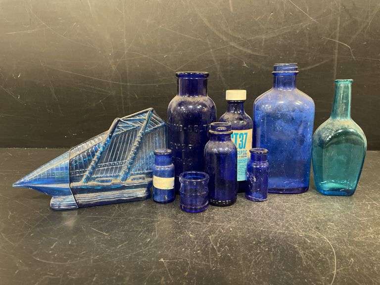 Blue elixir bottles - Auction Ohio