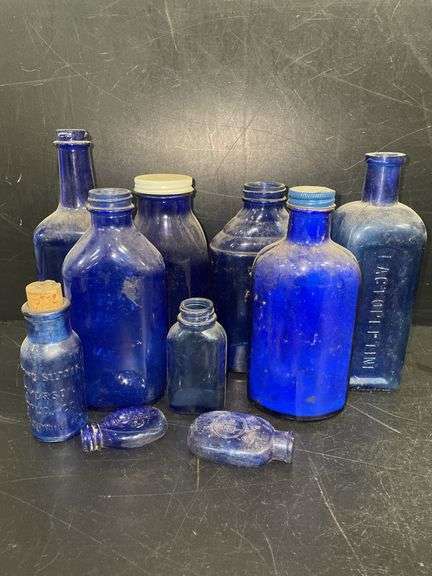 Blue Elixir bottles - Auction Ohio