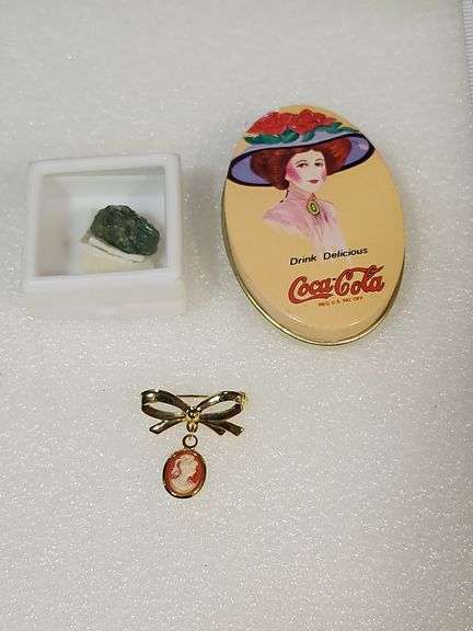 Emerald Rough Stone, Cameo Brooch, & Coca Cola Tin - Auction Ohio
