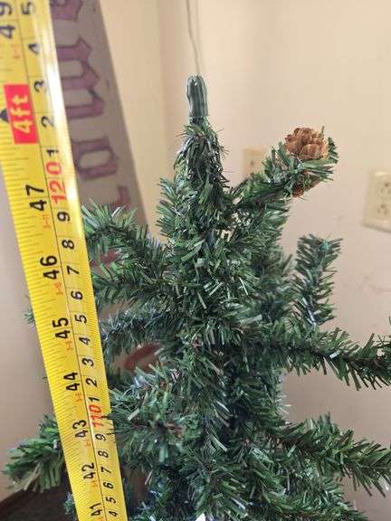 Artificial pine tree in long a burger basket - Auction Ohio