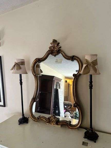 Ornate gold-framed mirror with candlestick lamps - Auction Ohio