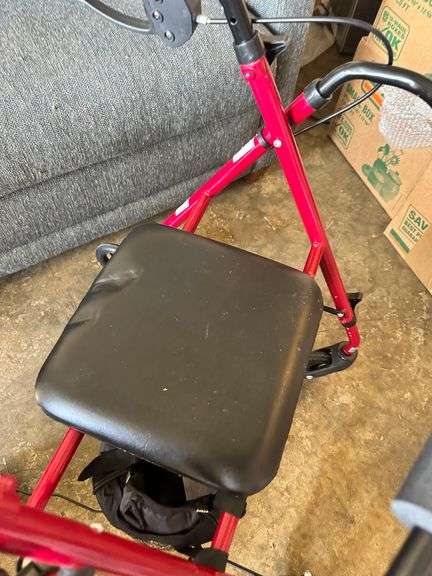Red rolling walker with seat - Auction Ohio