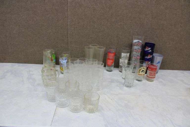 Assorted Glassware Including Sports-Themed Tumblers and Cartoon-Themed ...