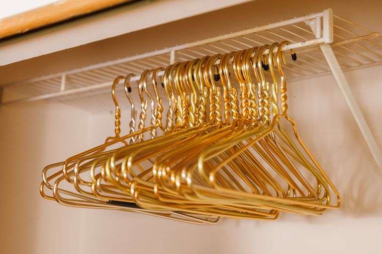 Set of Gold Metal Hangers - Auction Ohio