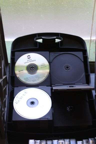 Collection of DVDs, CDs, and PC Video Games in Various Cases - Auction Ohio