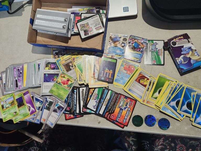 Assorted Pokémon 150+ Cards, Game Rules Pamphlet, & More - Auction Ohio