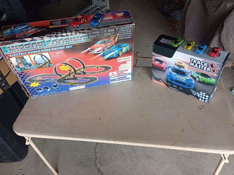 Two slot car racing sets with cars. Trackmaster 8, 1:64 scale and ...