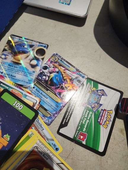 Assorted Pokémon 150+ Cards, Game Rules Pamphlet, & More - Auction Ohio