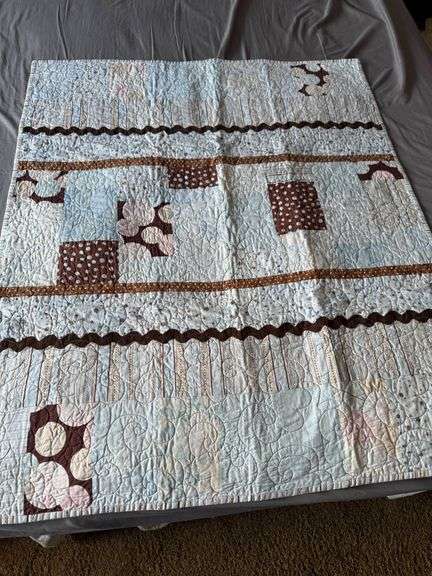 Handcrafted Patchwork Quilt with Blue and Brown Patterns - Auction Ohio