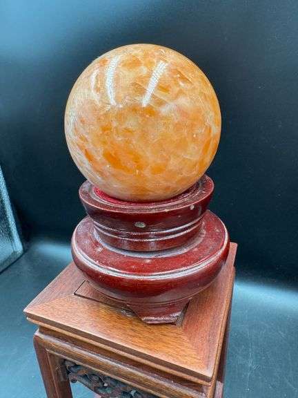 Vintage Polished Orange Calcite Sphere on Wooden Stand - Auction Ohio