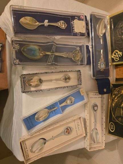 Brass belt buckles and collectors spoons - Auction Ohio