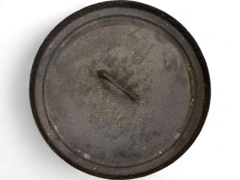 CAST IRON SPIDER SKILLET AND SPOON. - Auction Ohio