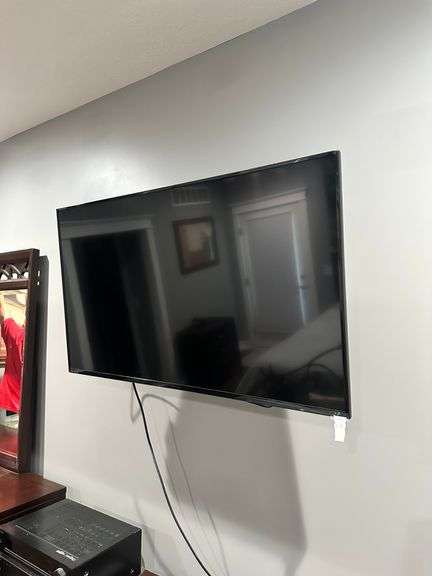 Wall-Mounted Flat Screen TV - Auction Ohio