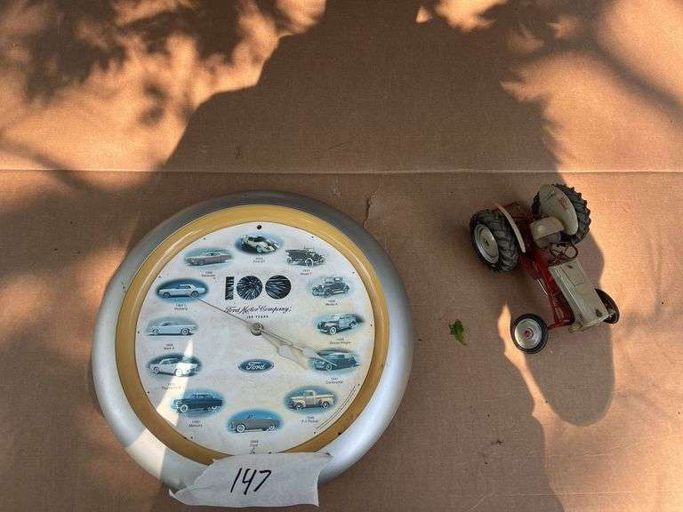 Ford motor company clock and a Ford tractor - Auction Ohio
