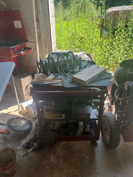 Red Metal Utility Cart with Assorted Mechanical Parts and Tools ...