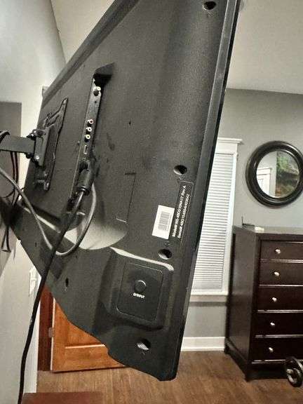 Wall-Mounted Flat Screen TV - Auction Ohio
