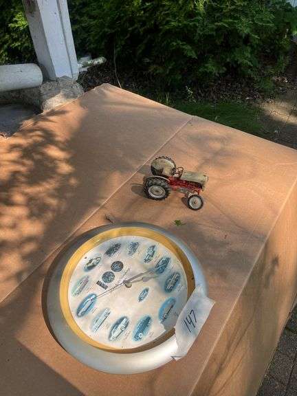 Ford motor company clock and a Ford tractor - Auction Ohio