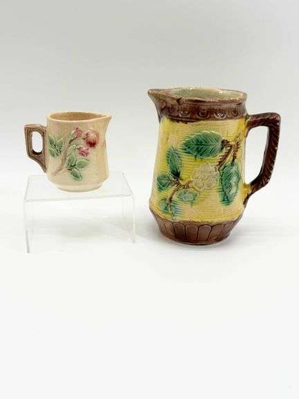 Two Ceramic Pitchers With Floral and Leaf Designs - Auction Ohio