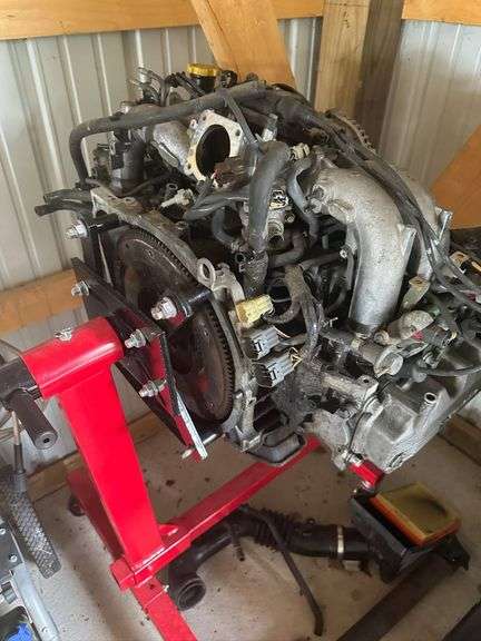Used Subaru Boxer Engine Mounted on a Red Engine Stand - Auction Ohio