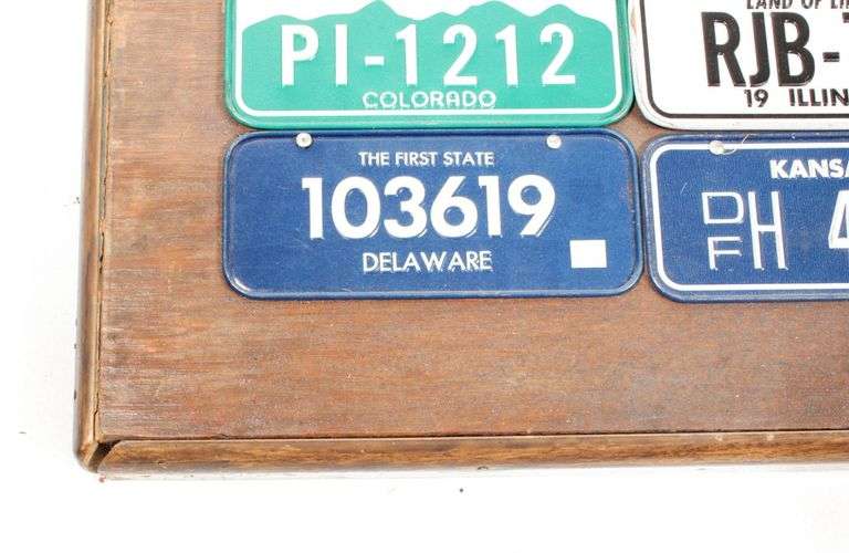 MOUNTED MOTORCYCLE LICENSE PLATES. - Auction Ohio