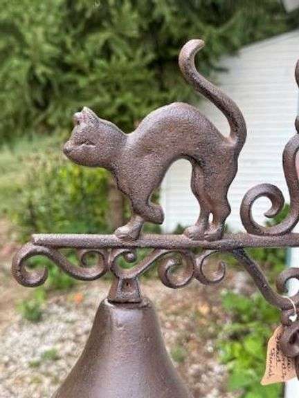 Wall-Mounted Cast Iron Bell with Cat Motif - Auction Ohio