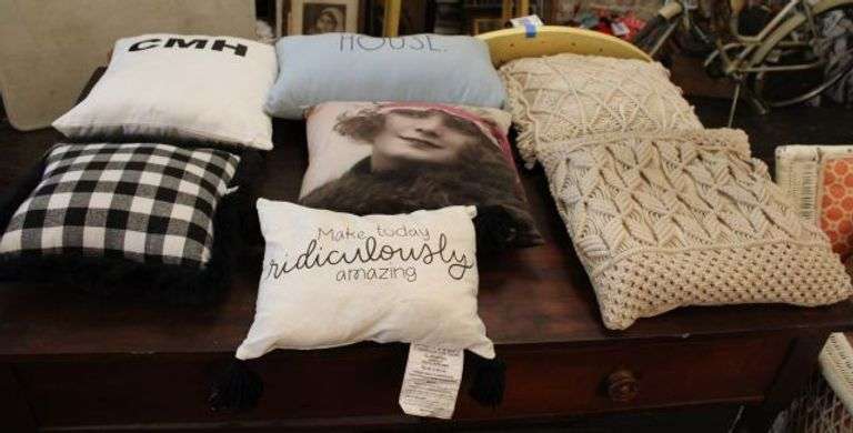 Seven Decorative Throw Pillows in Various Materials and Designs ...