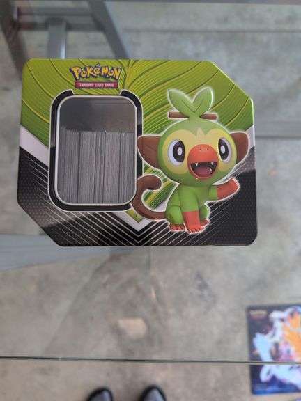 Pokemon Trading Cards in Collectible Grookey Tin - Auction Ohio