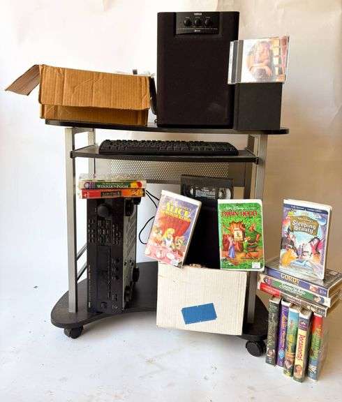 ROLLING DESK WITH YAMAHA RECEIVER, SPEAKERS, DISNEY VHS, AND CD LOT ...