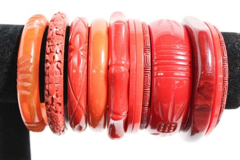 RED BAKELITE BANGLES. - Auction Ohio