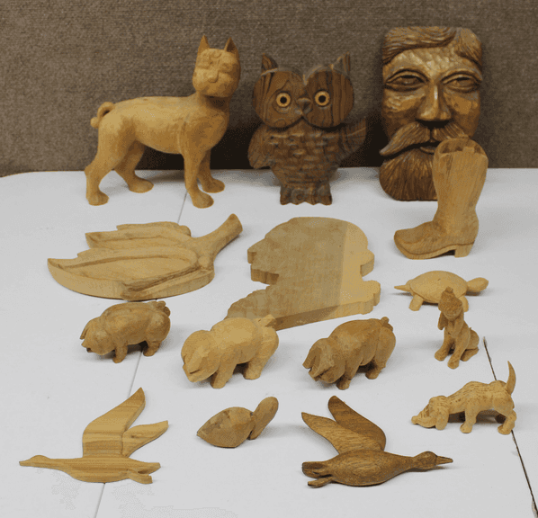 Hand-Carved Wooden Figures Including Animals and Faces - Auction Ohio