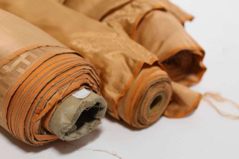 THREE BOLTS OF SALMON PINK SILK FABRIC WITH CHINESE PATTERNS. - Auction ...