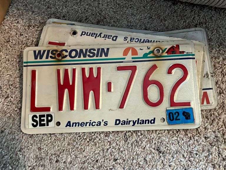 Four Wisconsin License Plates - Apexx Auctions