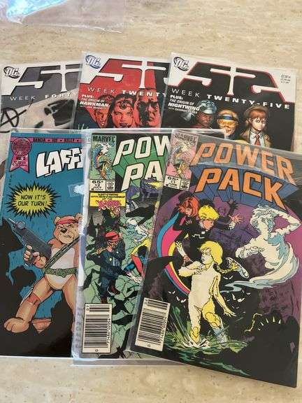 Comic Books. Two 52, Two Power Pack and a Laffin’ Gas - Apexx Auctions