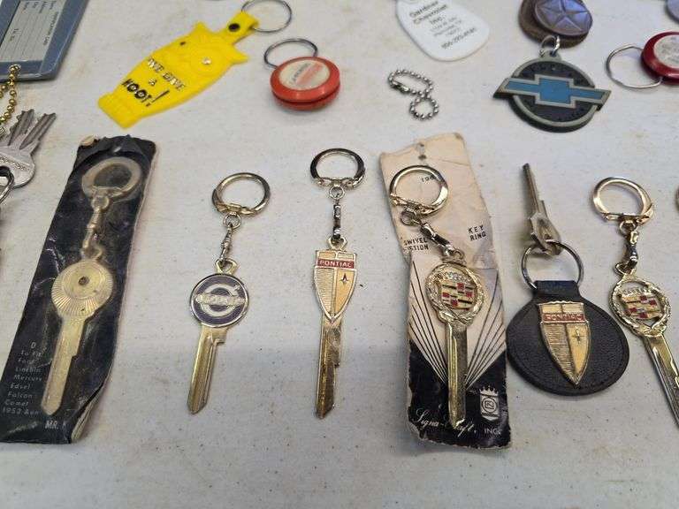 (27) Assorted Uncut Key Blanks & Various Key Chains - Assiter Auctioneers
