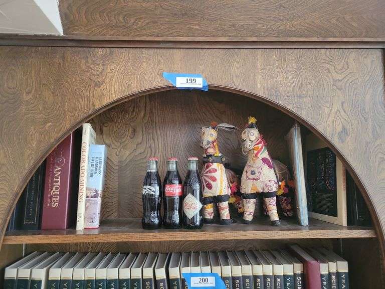 Various Book Titles, Three Classic Coke Bottles, and Two Decorative ...