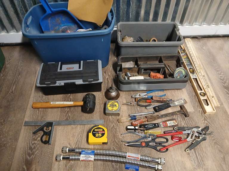 Group assorted tools including, rubber mallet, tape measures, pliers ...