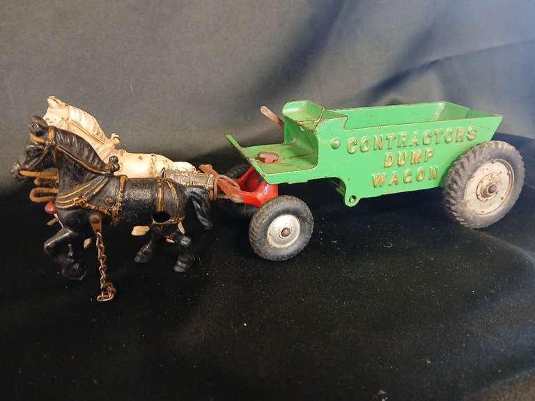 Arcade cast iron horse-drawn contractors dump wagon toy. 13" w ...