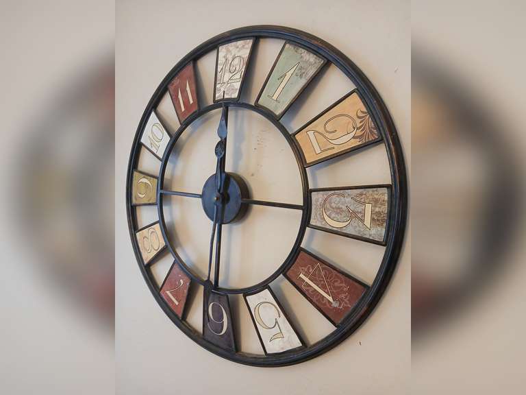 French Country tin wall hanging clock. 24"w - Bidaste Auctions