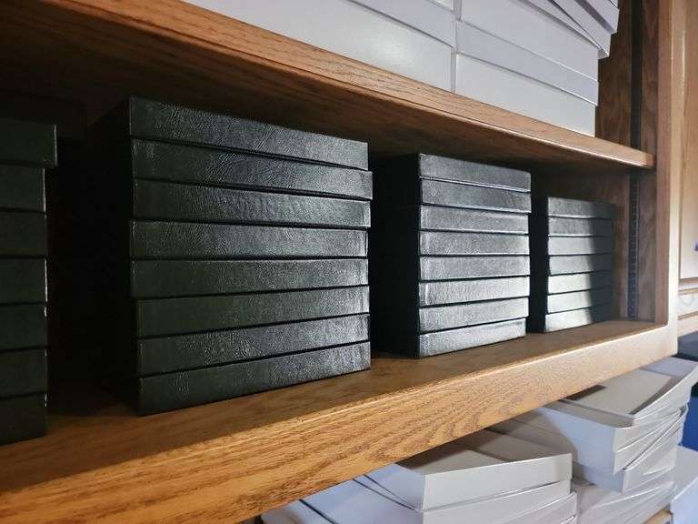 Black merchandise boxes 8x10 x1 in deep, shelf contents - Advantage Auction