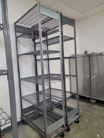 Two equipto storage carts 6 shelves each about 6 1/2 ft tall ...