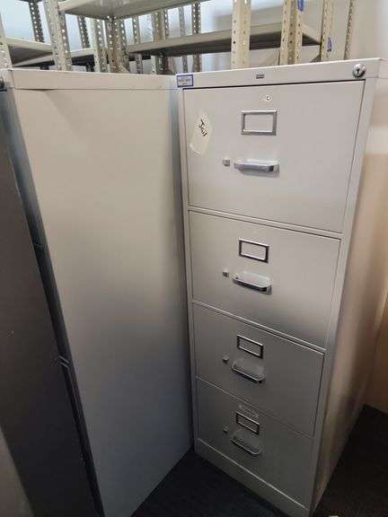 Two four drawer filing cabinets cream color - Advantage Auction