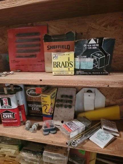 Sorted fasteners household oil and staple gun staples two shelves ...
