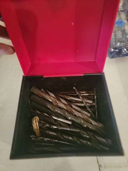 Red and black box with drill bits - Advantage Auction