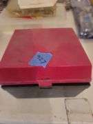 Red and black box with drill bits - Advantage Auction