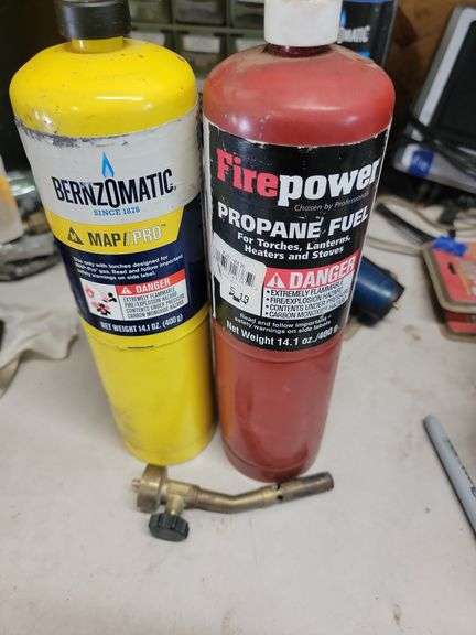 Red and yellow propane canisters and nozzle - Advantage Auction
