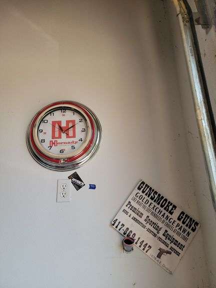 Hornady wall clock, gunsmoke guns metal sign - Advantage Auction
