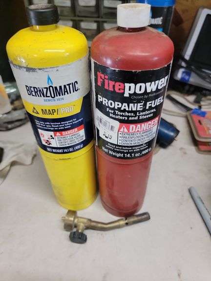 Red and yellow propane canisters and nozzle - Advantage Auction