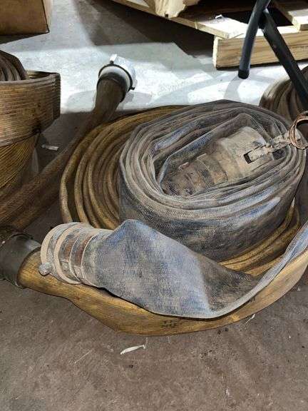 2 Bundles of Lg. Rubber Fire Hose - Baer Auctioneers - Realty, LLC