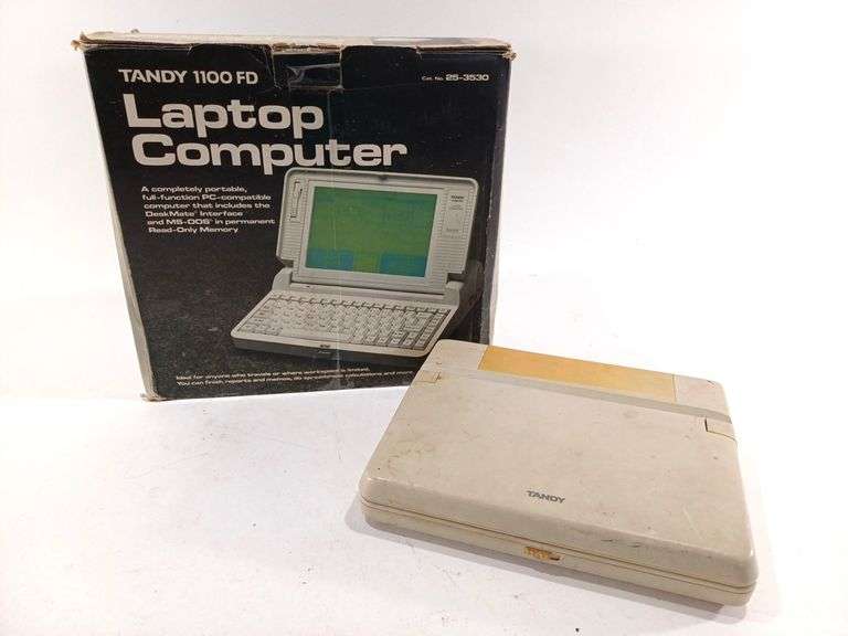 VTG Tandy 1100 FD Laptop Computer - Black And Gold Auctions