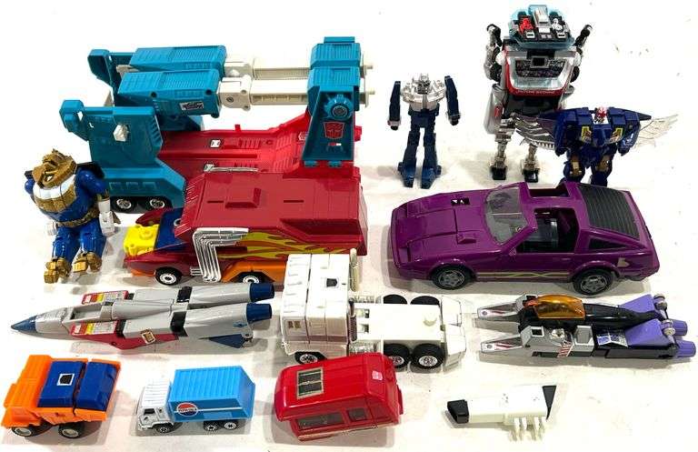 Vintage 80’s Transformer / Car Toys - Black And Gold Auctions